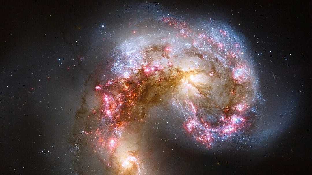 La combinazione di starburst e buchi neri attivi rende alcuni ammassi ...